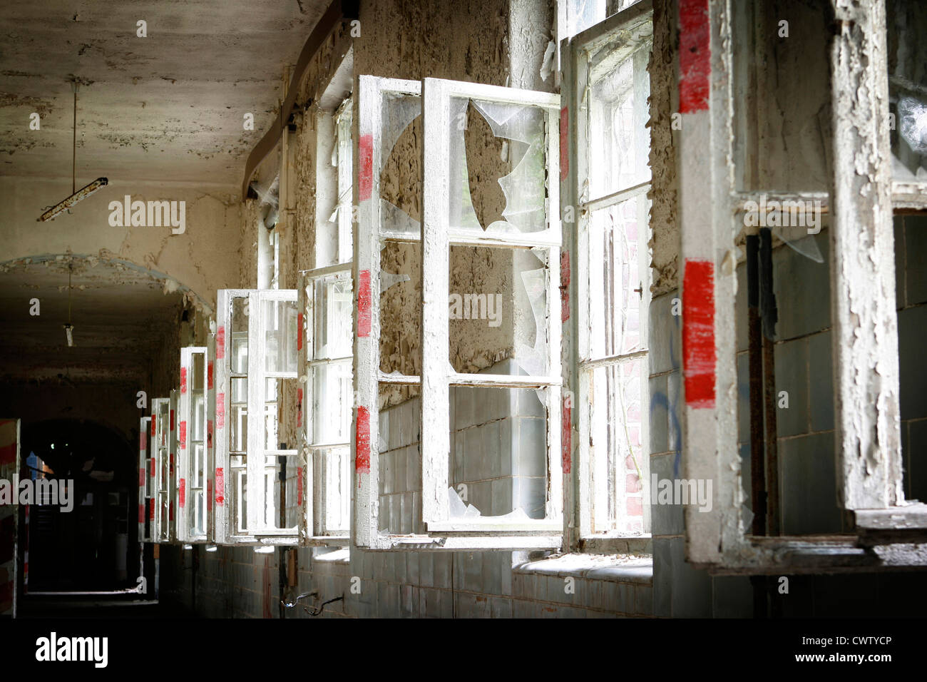 Broken windows at a building Stock Photo - Alamy