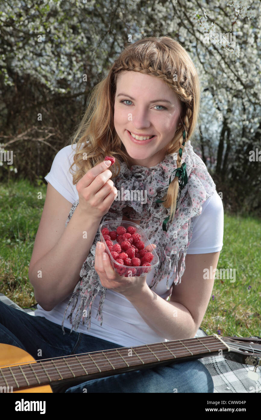 Woman eating berry tree hi-res stock photography and images - Alamy
