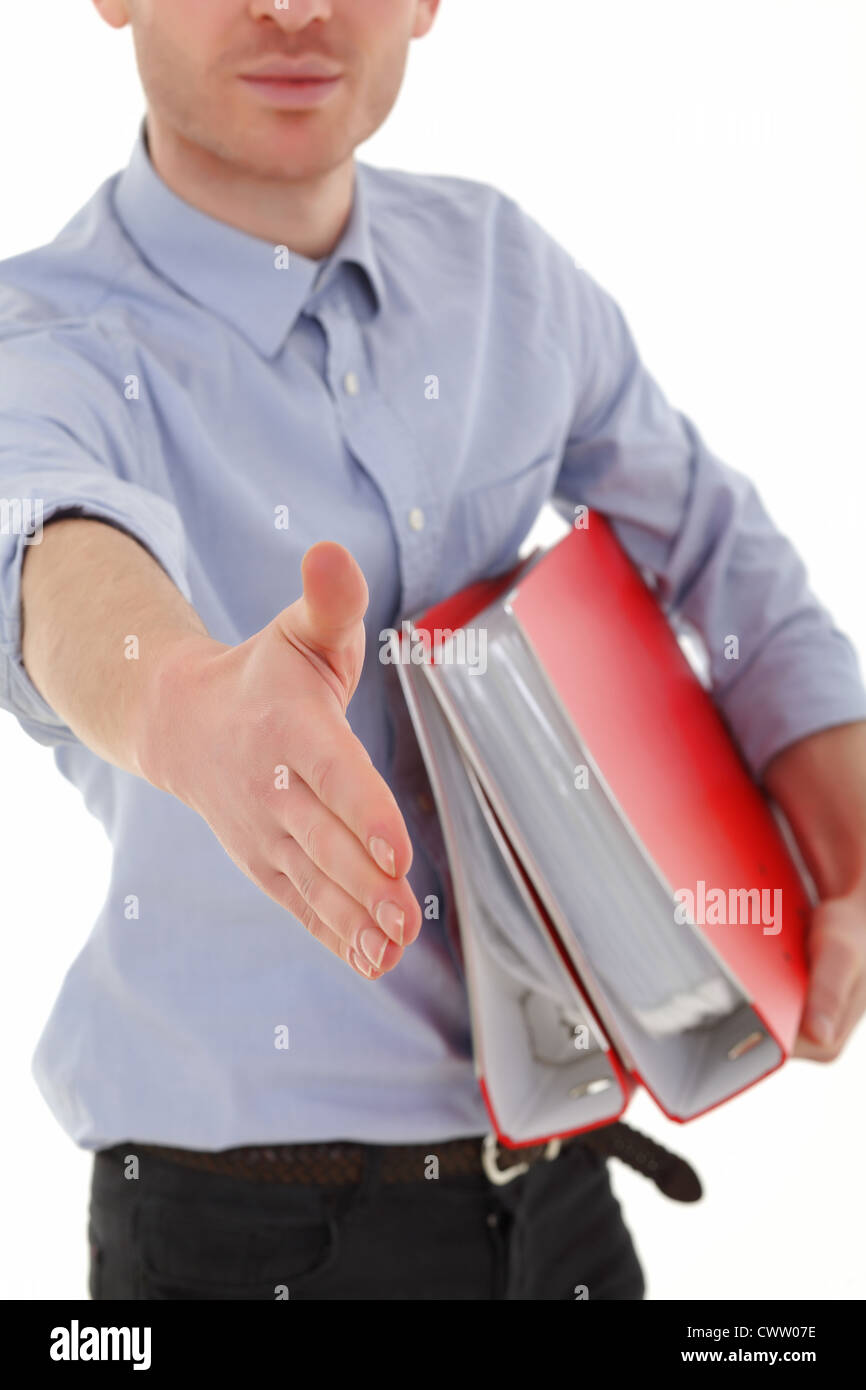Young man giving hand holding folders Stock Photo - Alamy