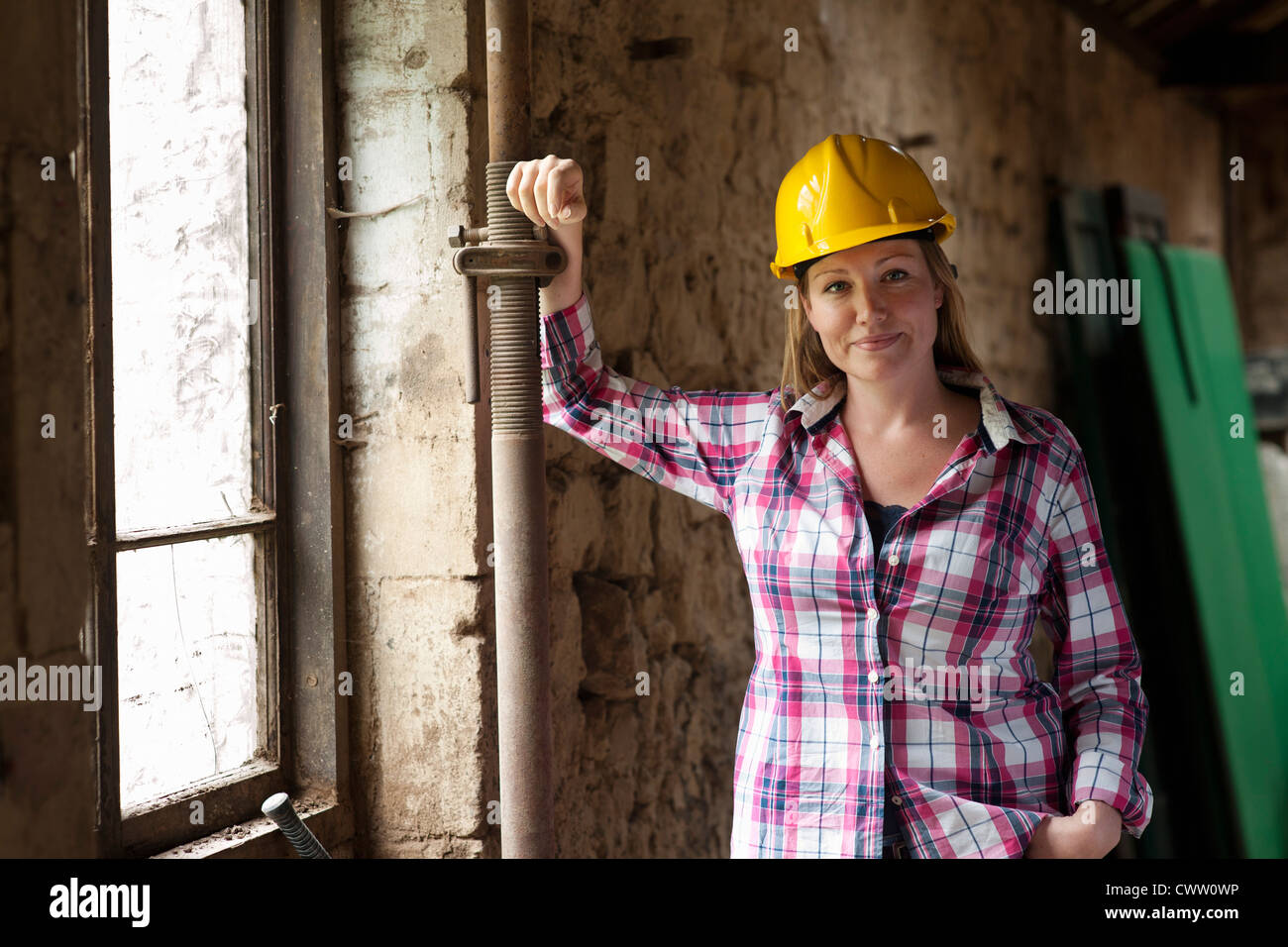 Construction worker smiling on site Stock Photo - Alamy