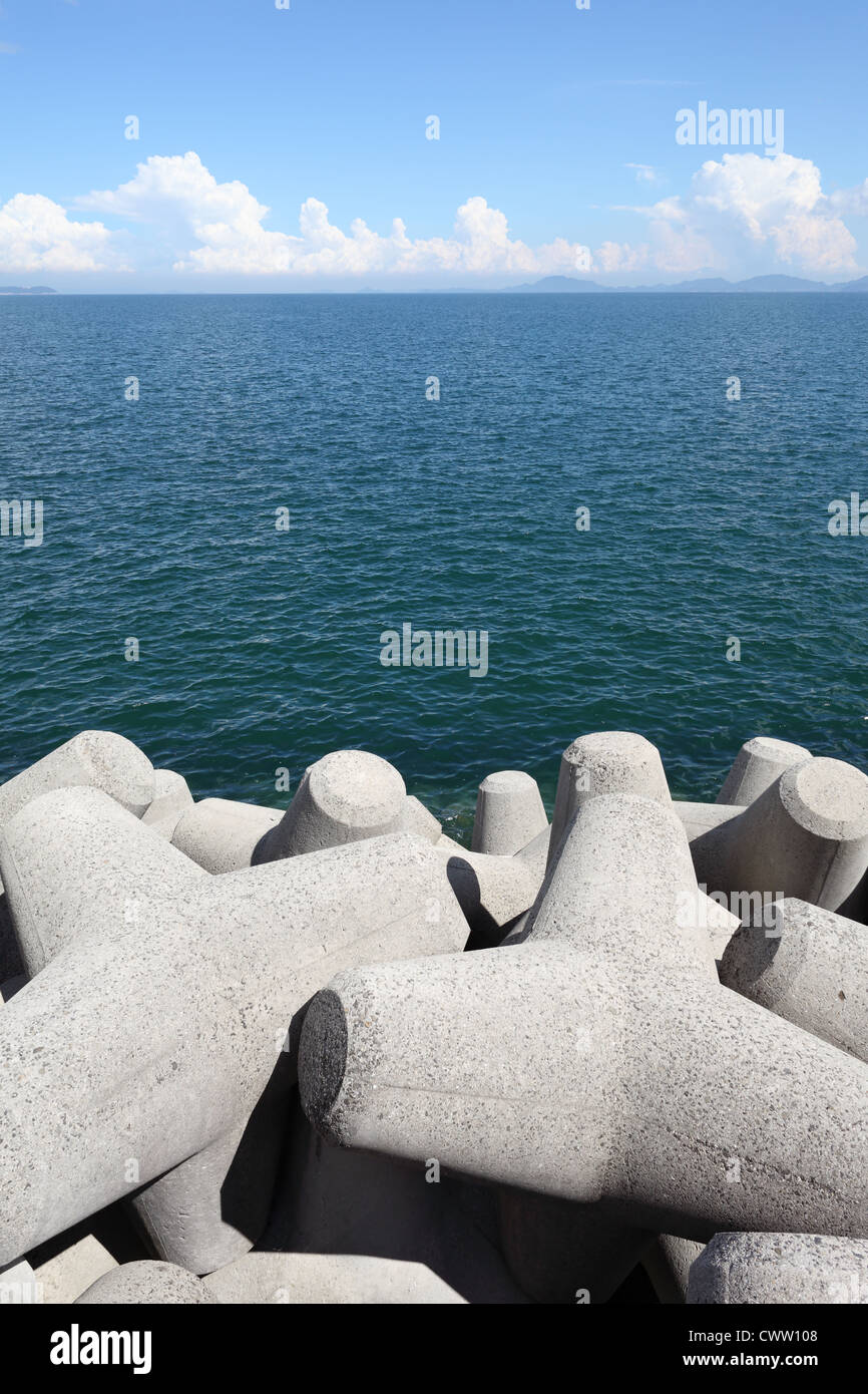 Breakwater with concrete blocks for protection of coast Stock Photo - Alamy