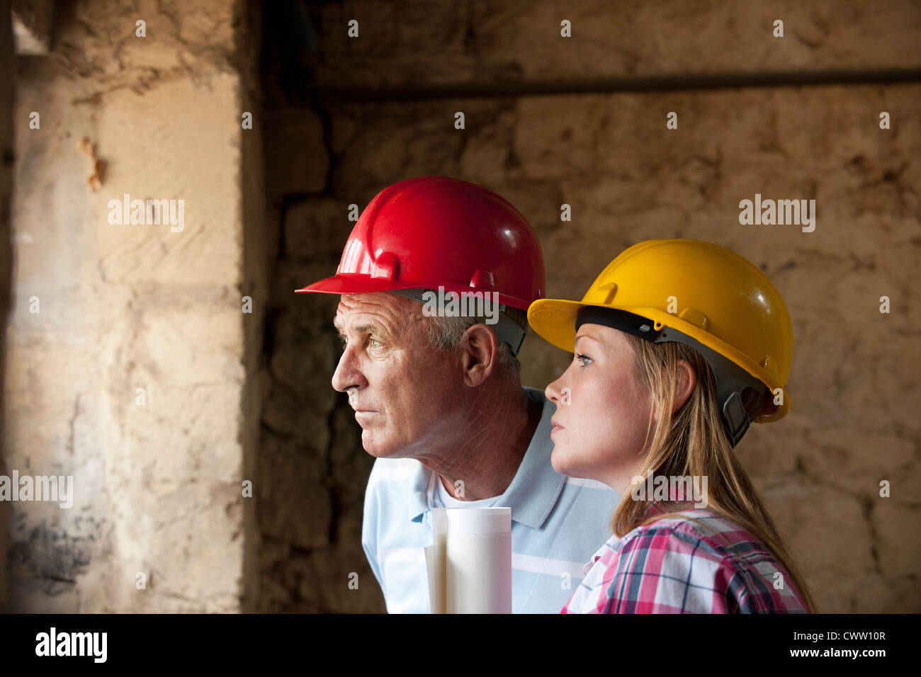 Construction workers standing on site Stock Photo - Alamy
