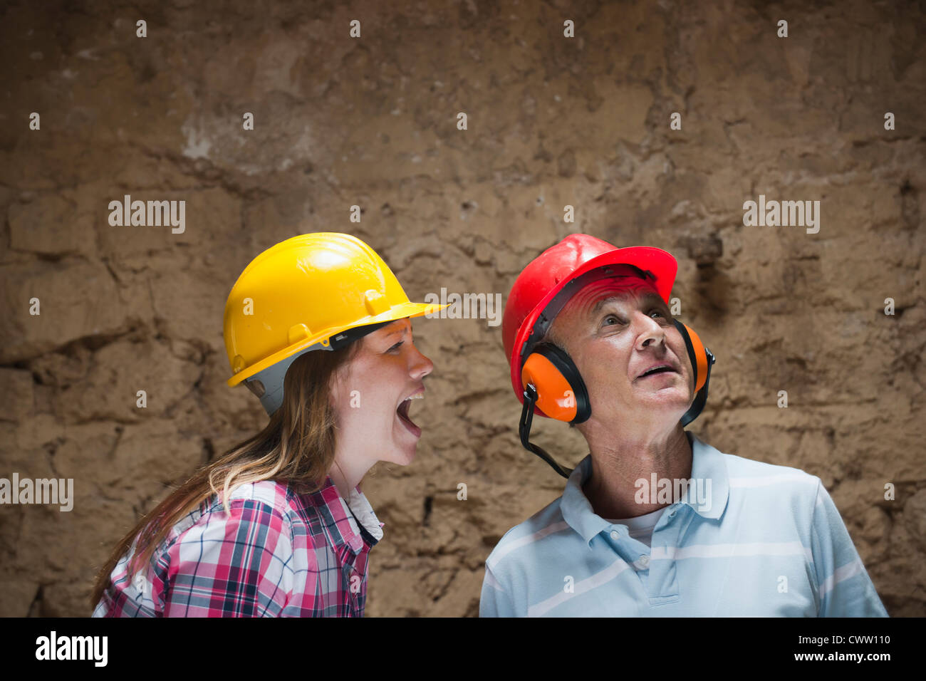 Construction worker yelling at colleague Stock Photo - Alamy