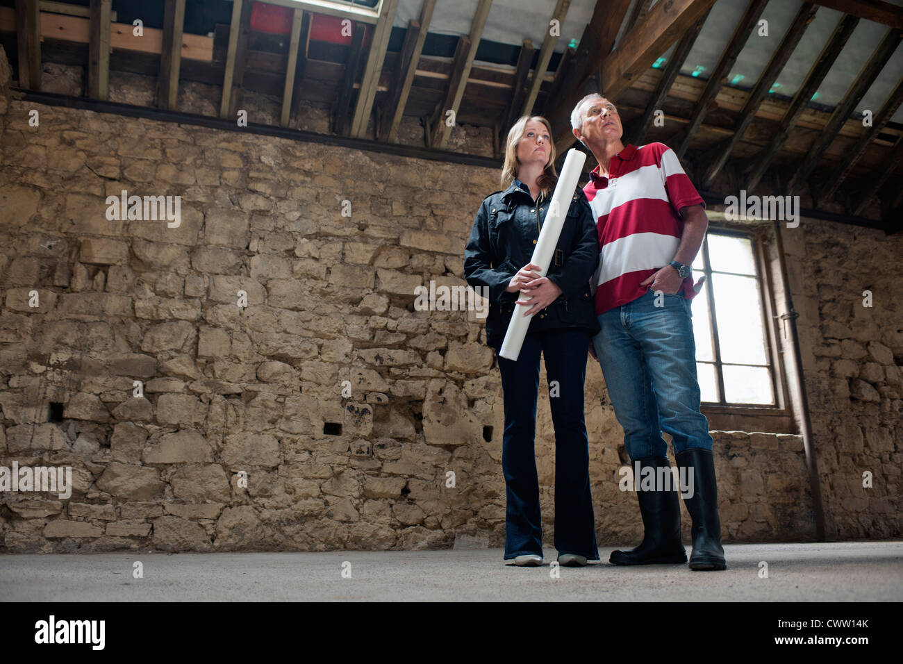 Father and daughter examining building Stock Photo - Alamy