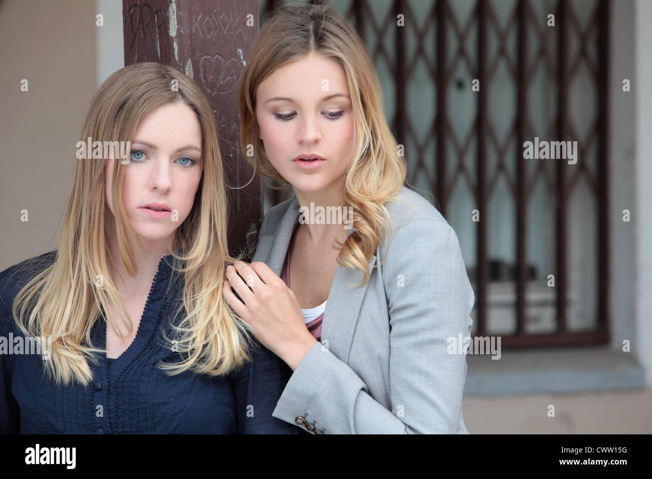 Two serious blond women outdoors Stock Photo - Alamy