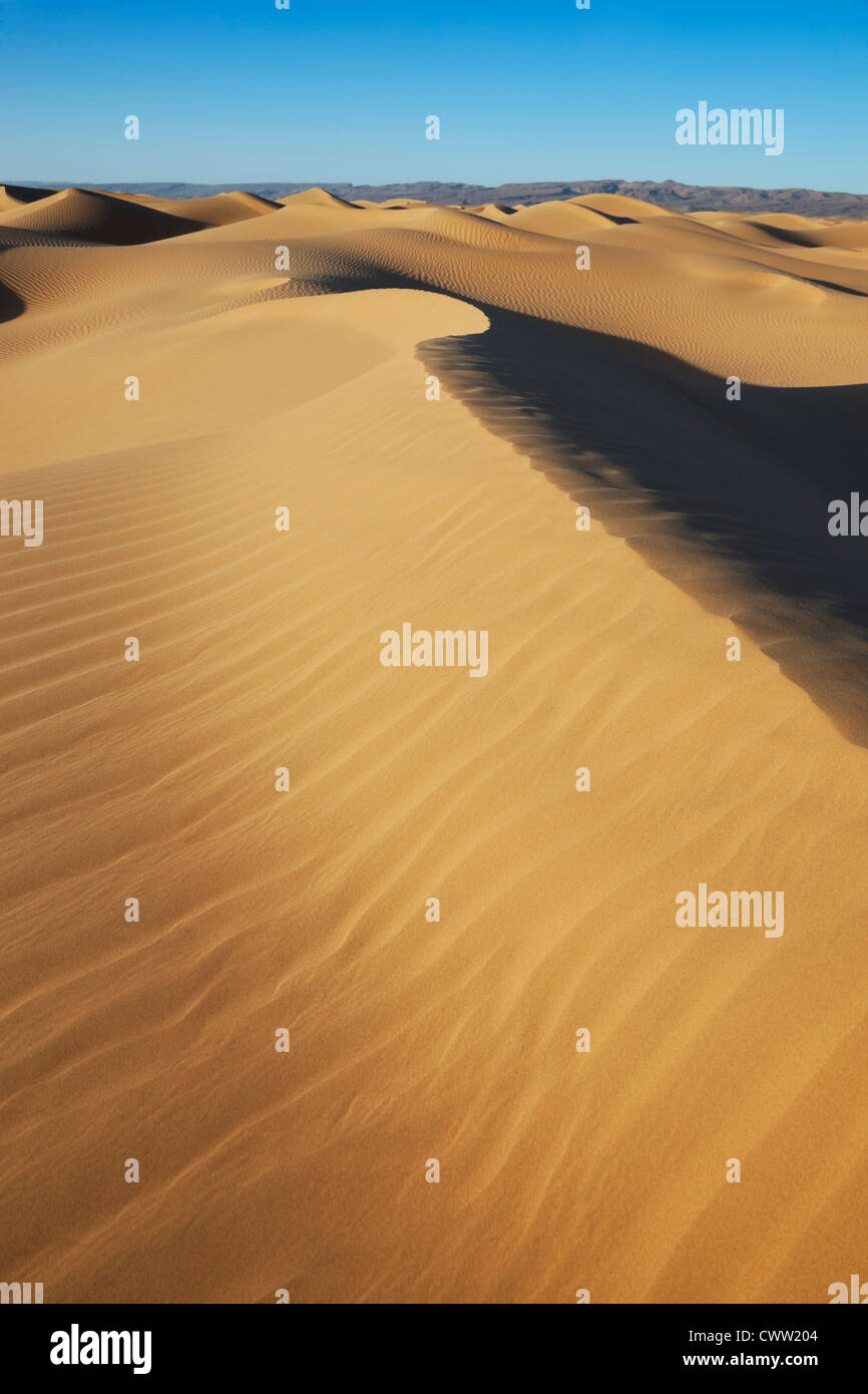 Sahara desert sand dunes with clear blue sky, Morocco Stock Photo - Alamy