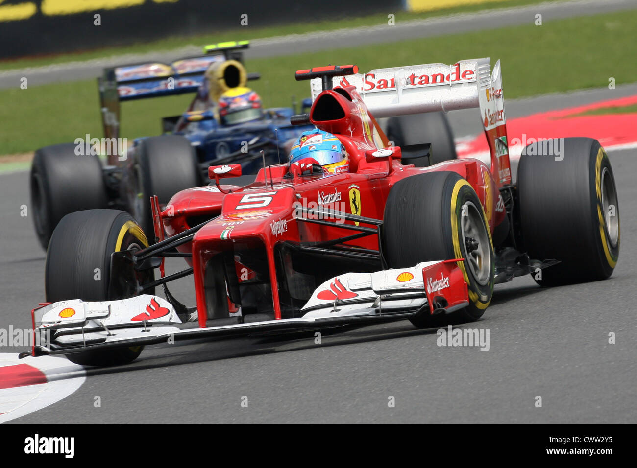 Fernando Alonso (Ferrari) leads Mark Webber (Red Bull Racing) action ...