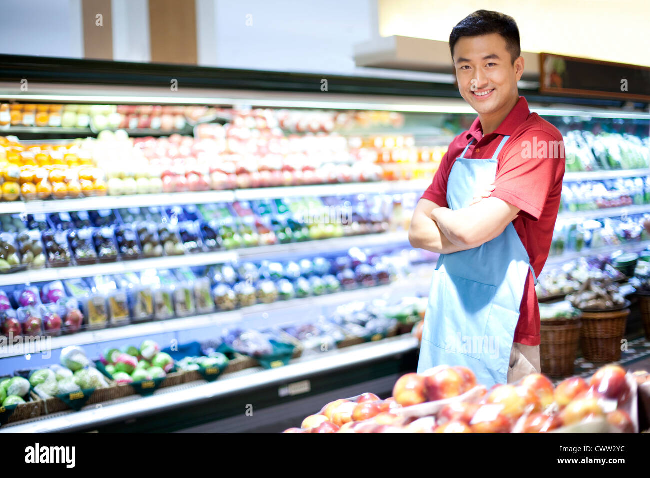 Sales clerk in supermarket Stock Photo - Alamy