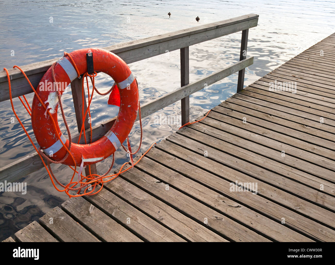 Lifebuoy on the wooden pier Stock Photo - Alamy