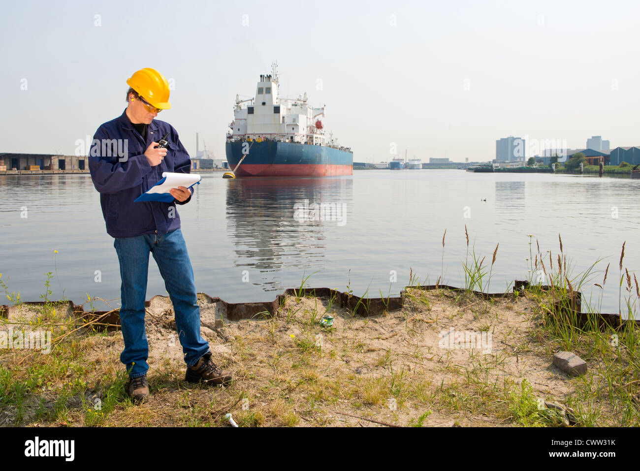 docker passing on instructions from his clipboard over the radio in an ...