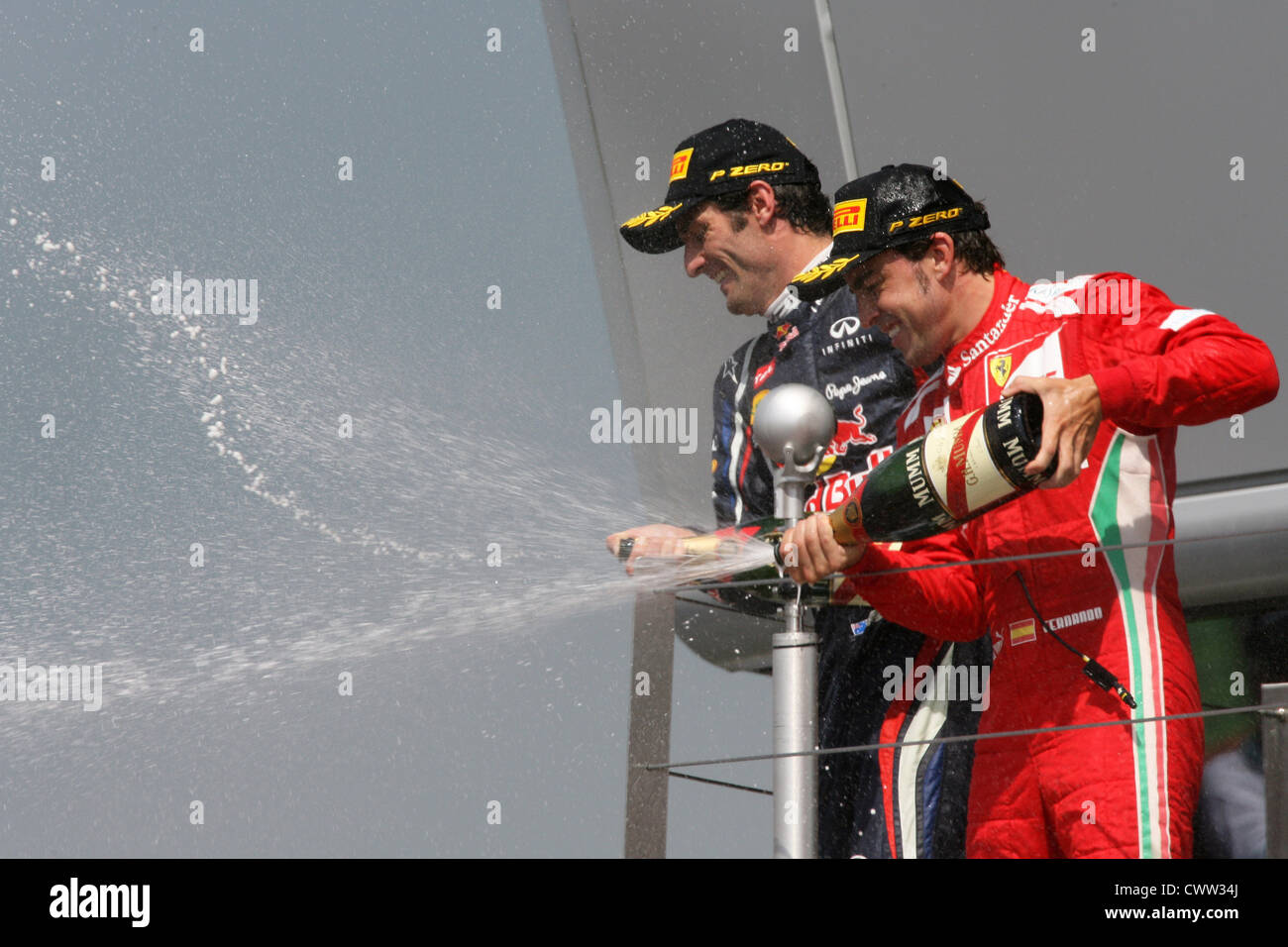 Mark Webber (Red Bull Racing) with Fernando Alonso (Ferrari) British ...