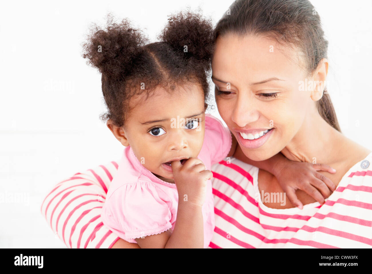 Smiling mother holding daughter Stock Photo - Alamy Smiling mother holding daughter Stock Photo - Alamy