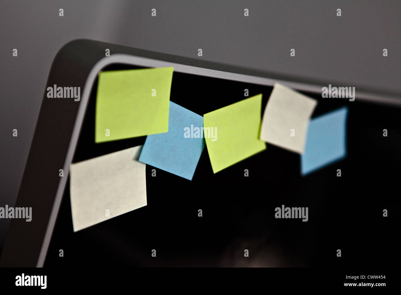 Blank adhesive notes at computer monitor Stock Photo - Alamy
