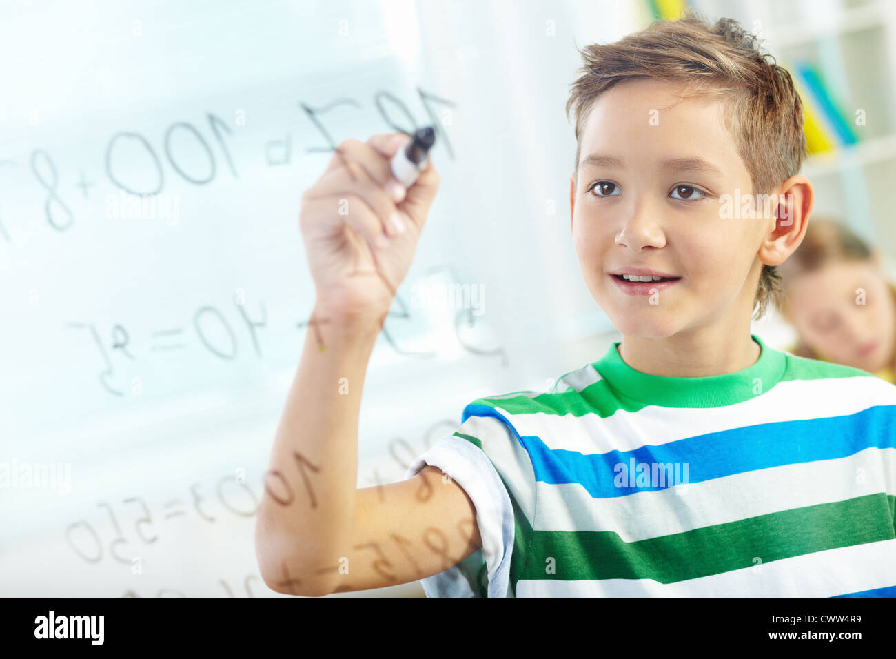 Schoolboy doing maths hi-res stock photography and images - Alamy