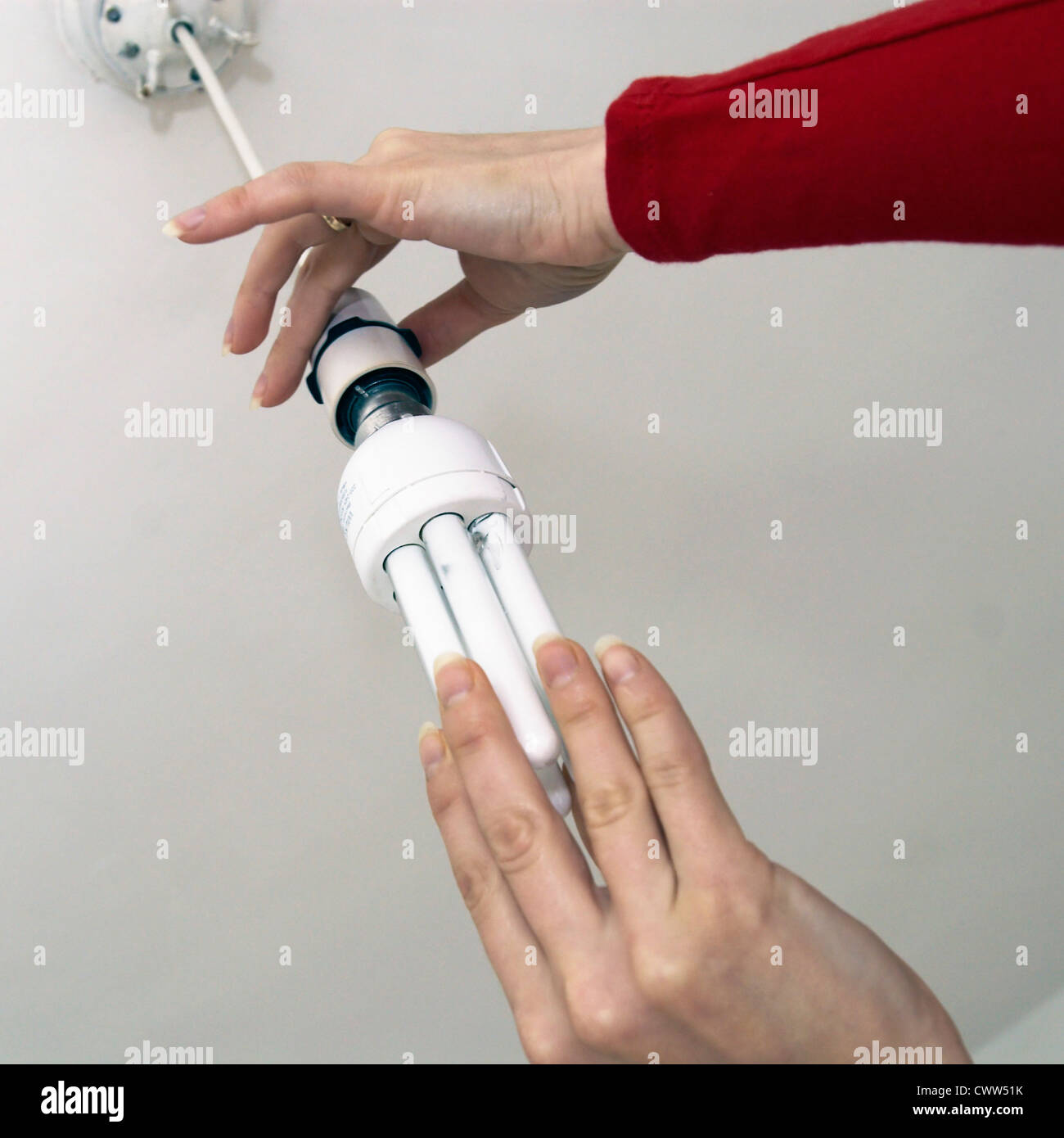 Fixing Light Fitting Woman High Resolution Stock Photography and Images ...