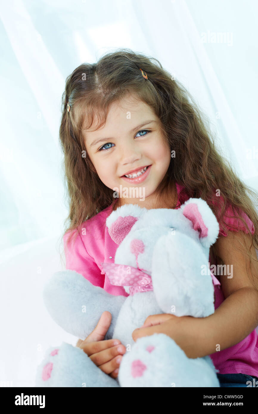 Portrait of lovely girl with teddybear looking at camera Stock Photo - Alamy