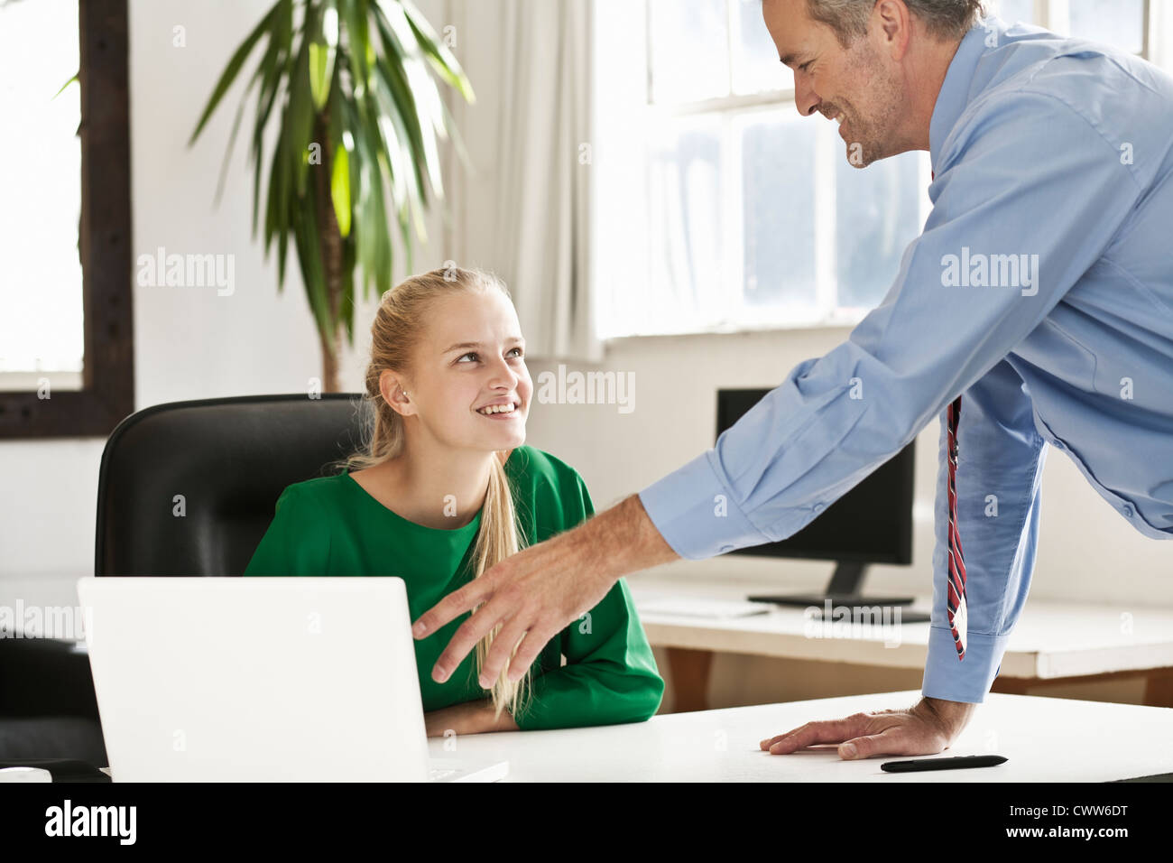 Business people talking in office Stock Photo - Alamy