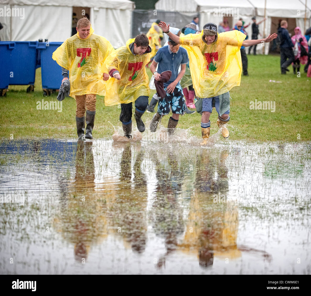 Music fans brave the mud and the rain at the main stage during T In The ...