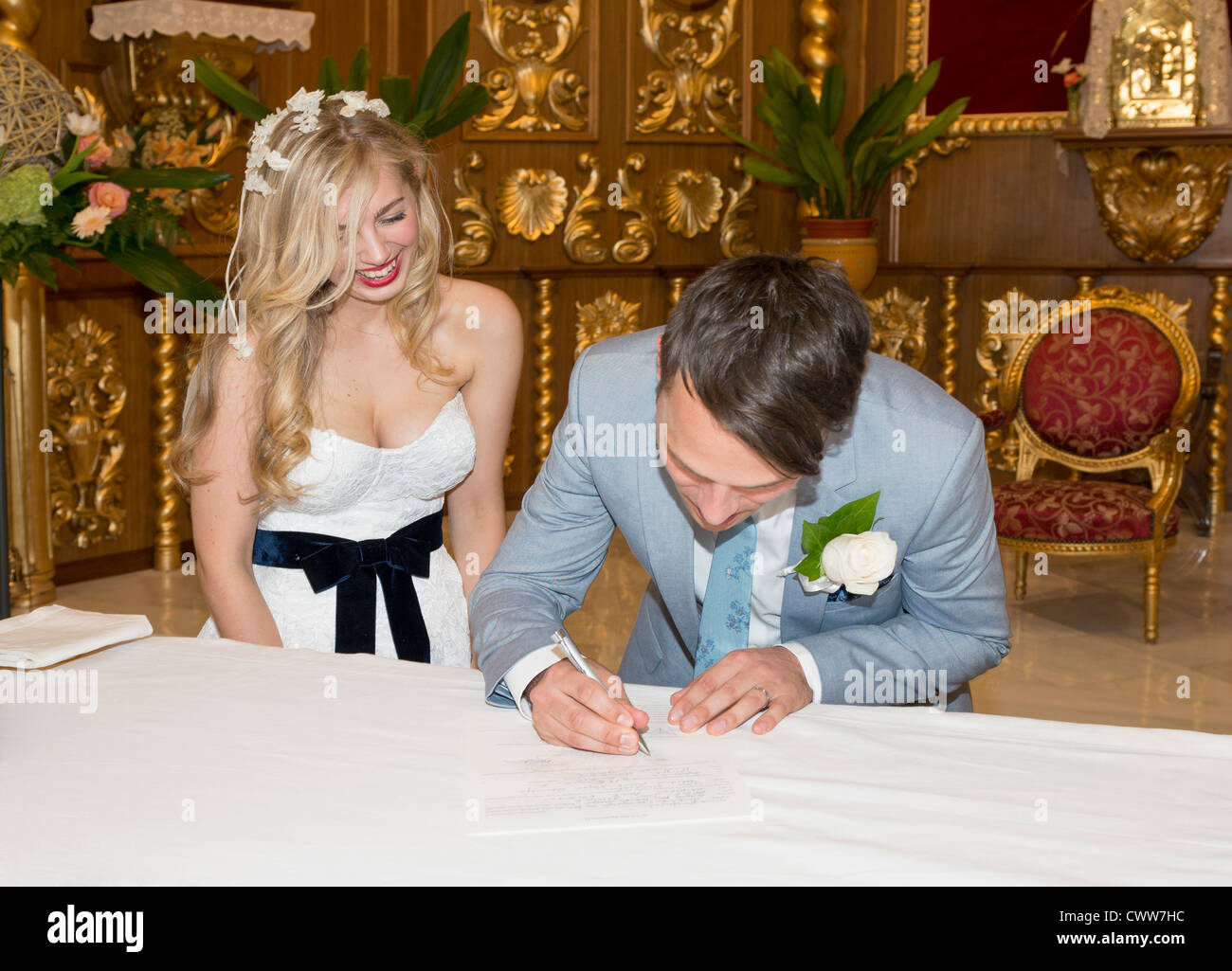 Bride and Groom signing the register in church in Spain Stock Photo - Alamy