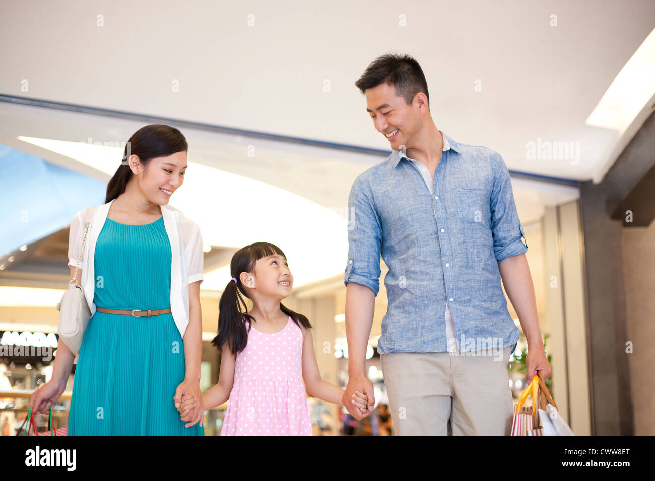 Family shopping in department store Stock Photo - Alamy