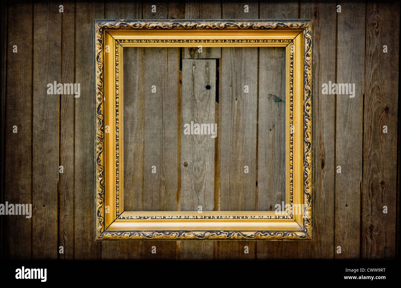 Golden empty frame on a wooden rustic textured background Stock Photo ...
