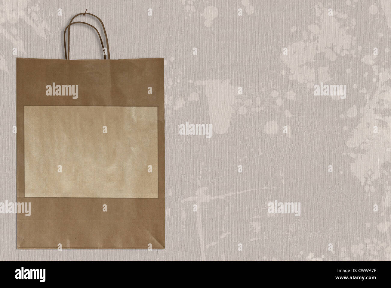 Paper bag hanging on spotted linen structure Stock Photo - Alamy