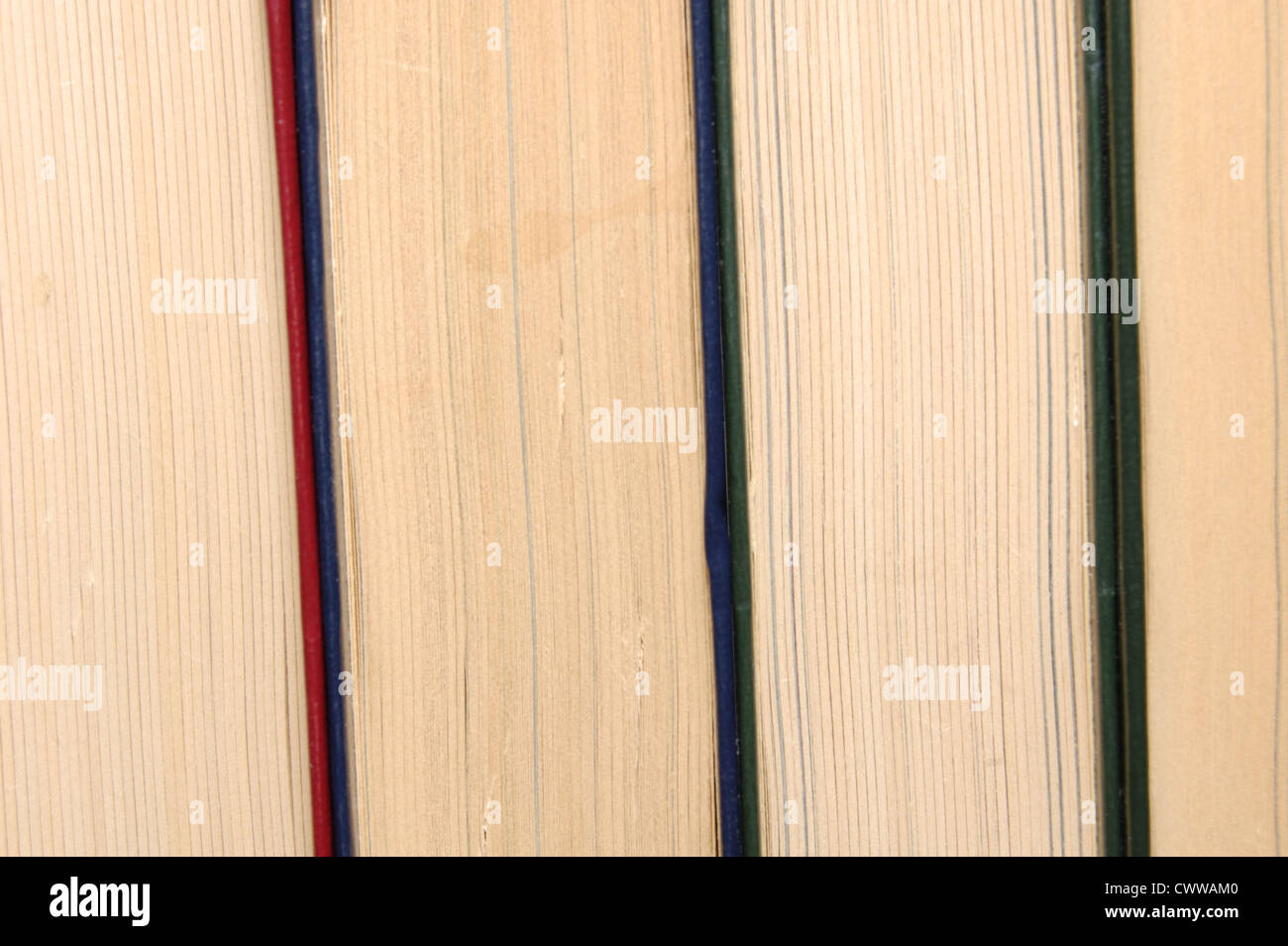 Row of books showing pages as a background Stock Photo - Alamy