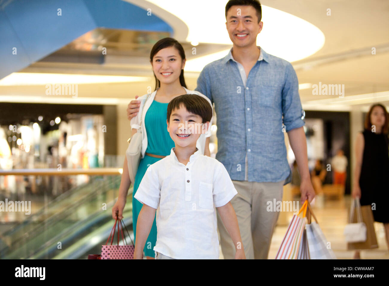 Family shopping in department store Stock Photo - Alamy