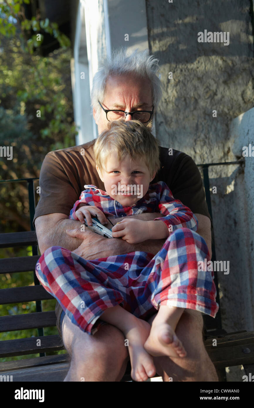 Grandson hugging grandpa hi-res stock photography and images - Alamy