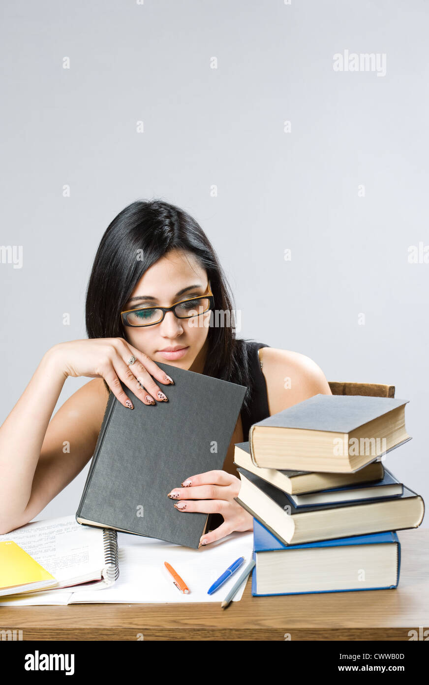 Much to work through, portrait of a worried young student girl with ...