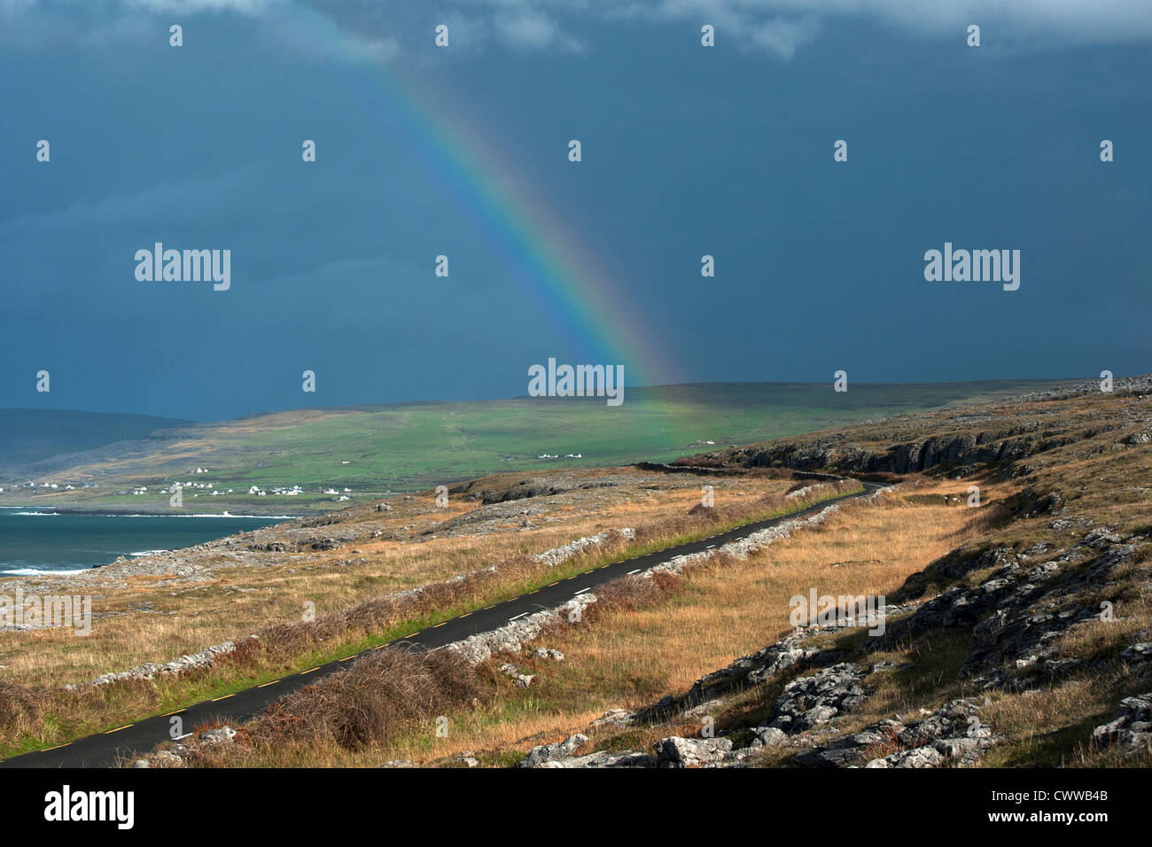 Rainbow over rural landscape Stock Photo - Alamy