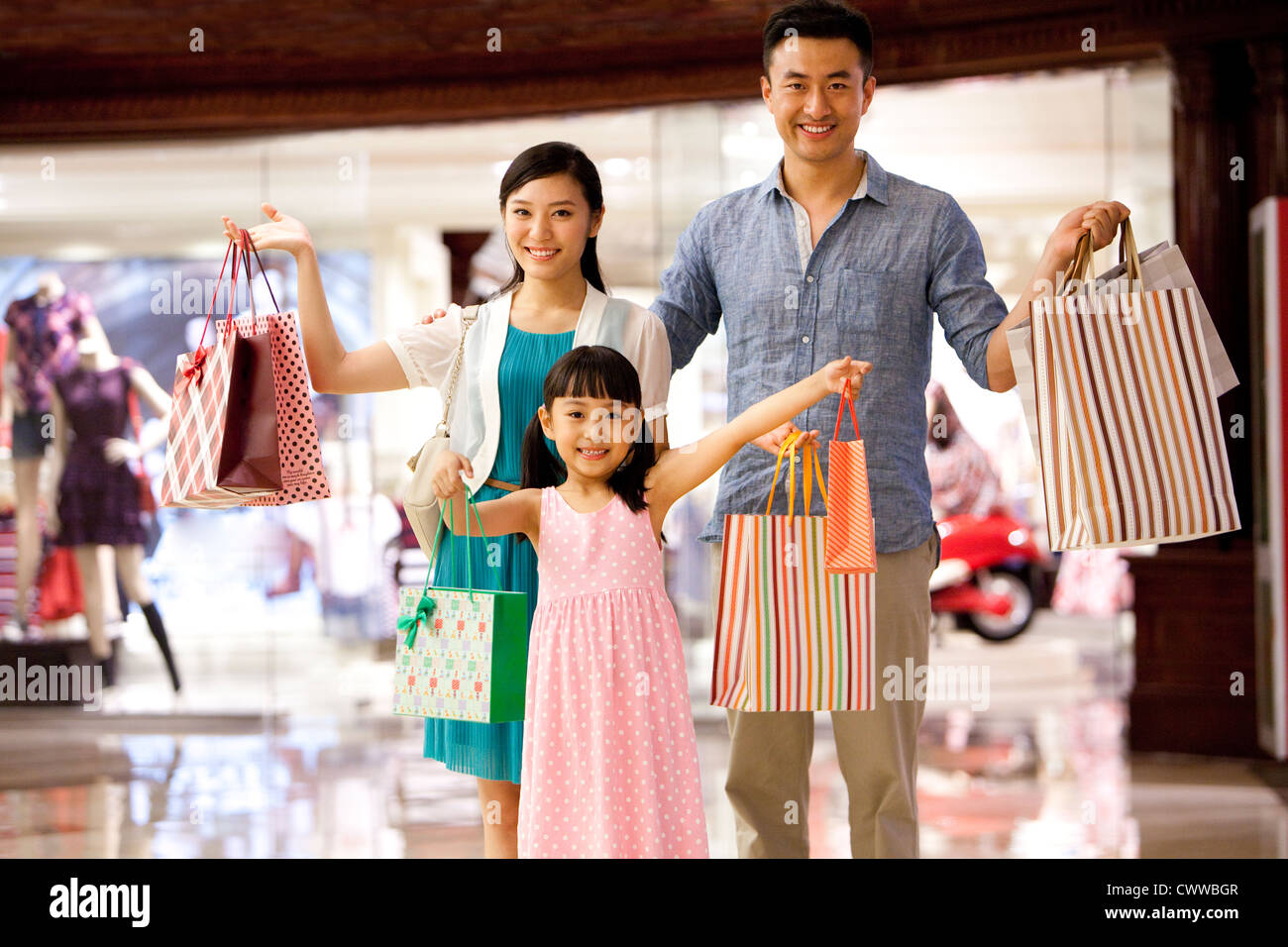 Family shopping in department store Stock Photo - Alamy