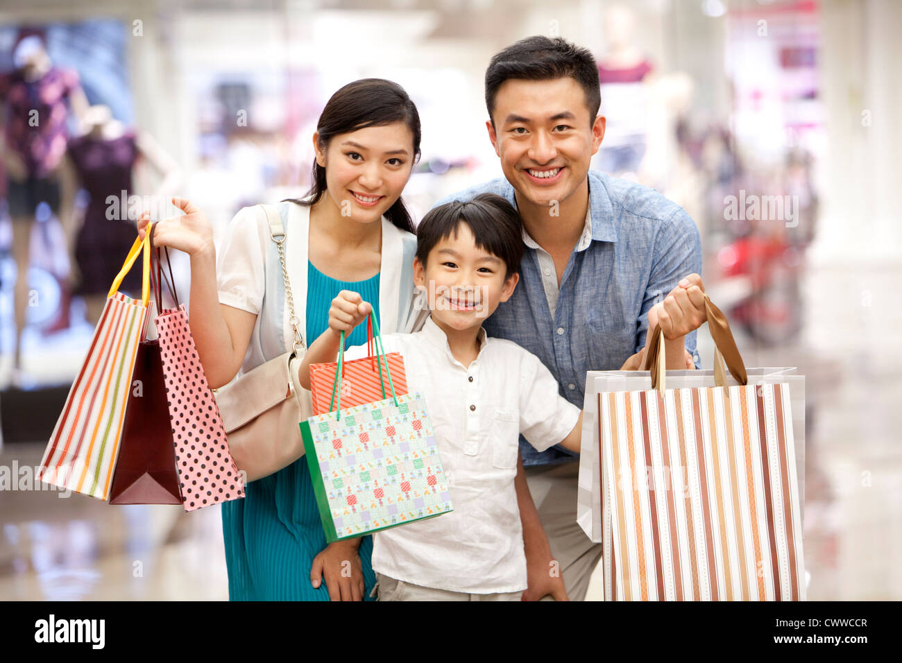 Family shopping in department store Stock Photo - Alamy