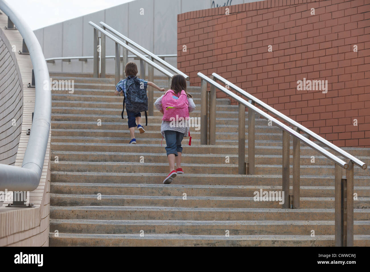 Children climbing stairs outdoors Stock Photo - Alamy