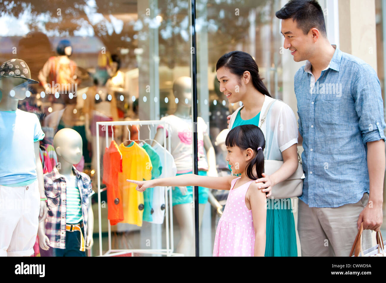 Family shopping in department store Stock Photo - Alamy