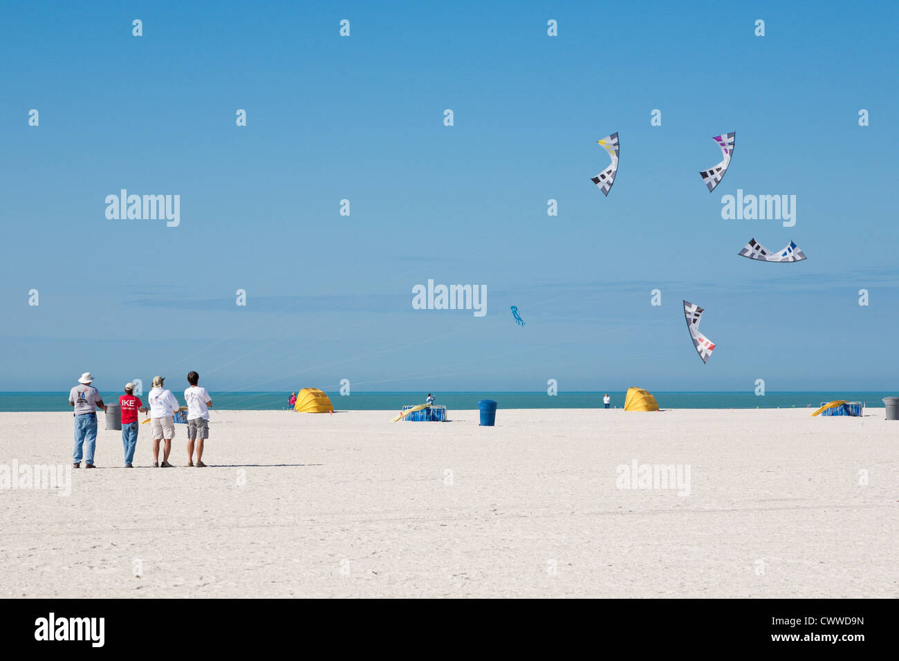 Four men demonstrate synchronized flying on St. Pete Beach at the ...