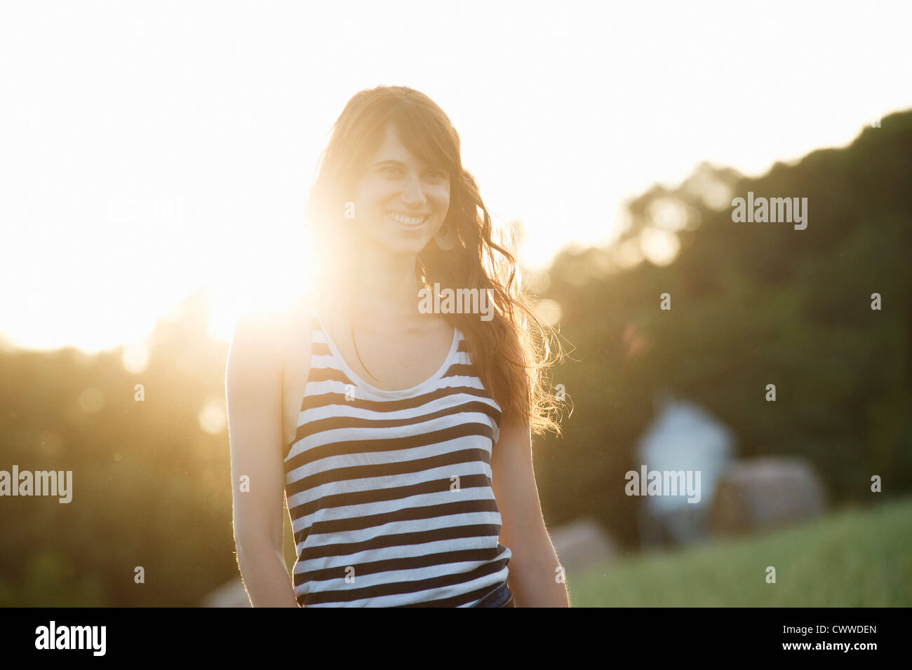 Smiling woman walking outdoors Stock Photo - Alamy