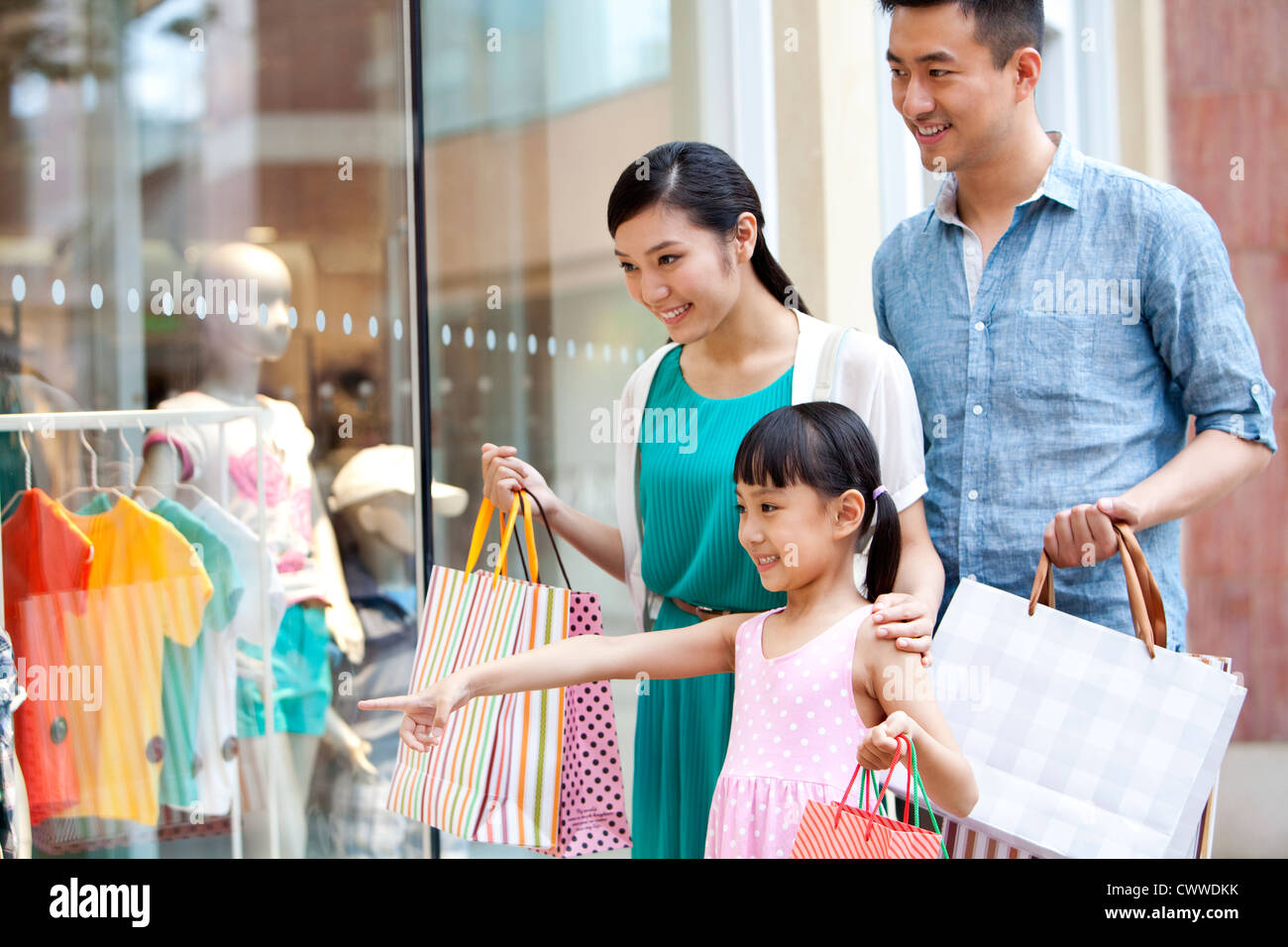 Family shopping in department store Stock Photo - Alamy