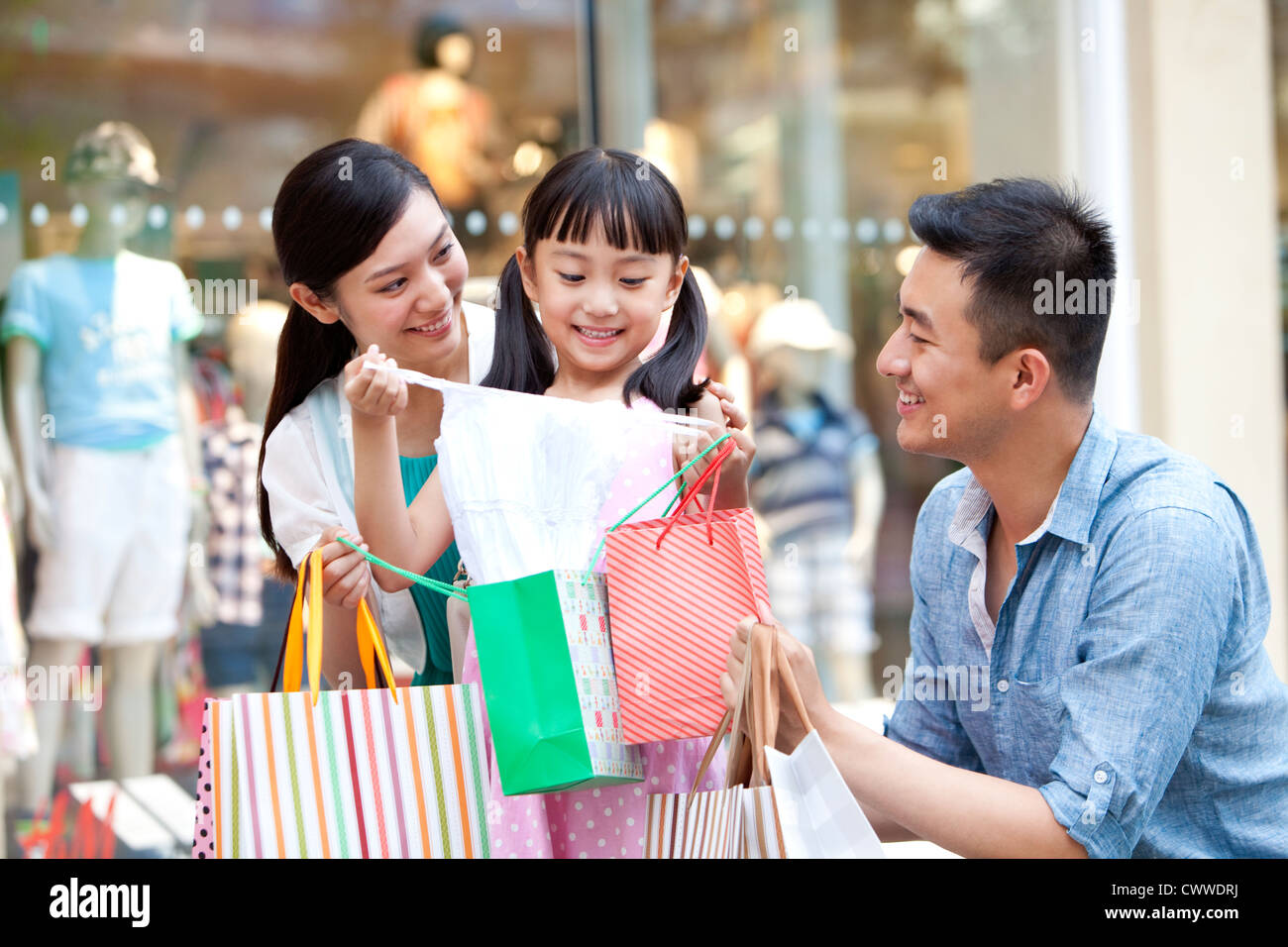 Family shopping in department store Stock Photo - Alamy