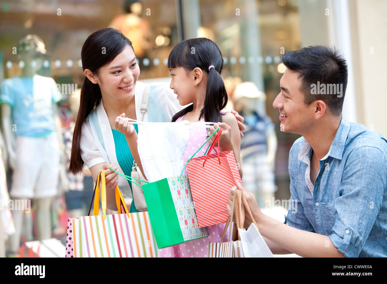 Family shopping in department store Stock Photo - Alamy