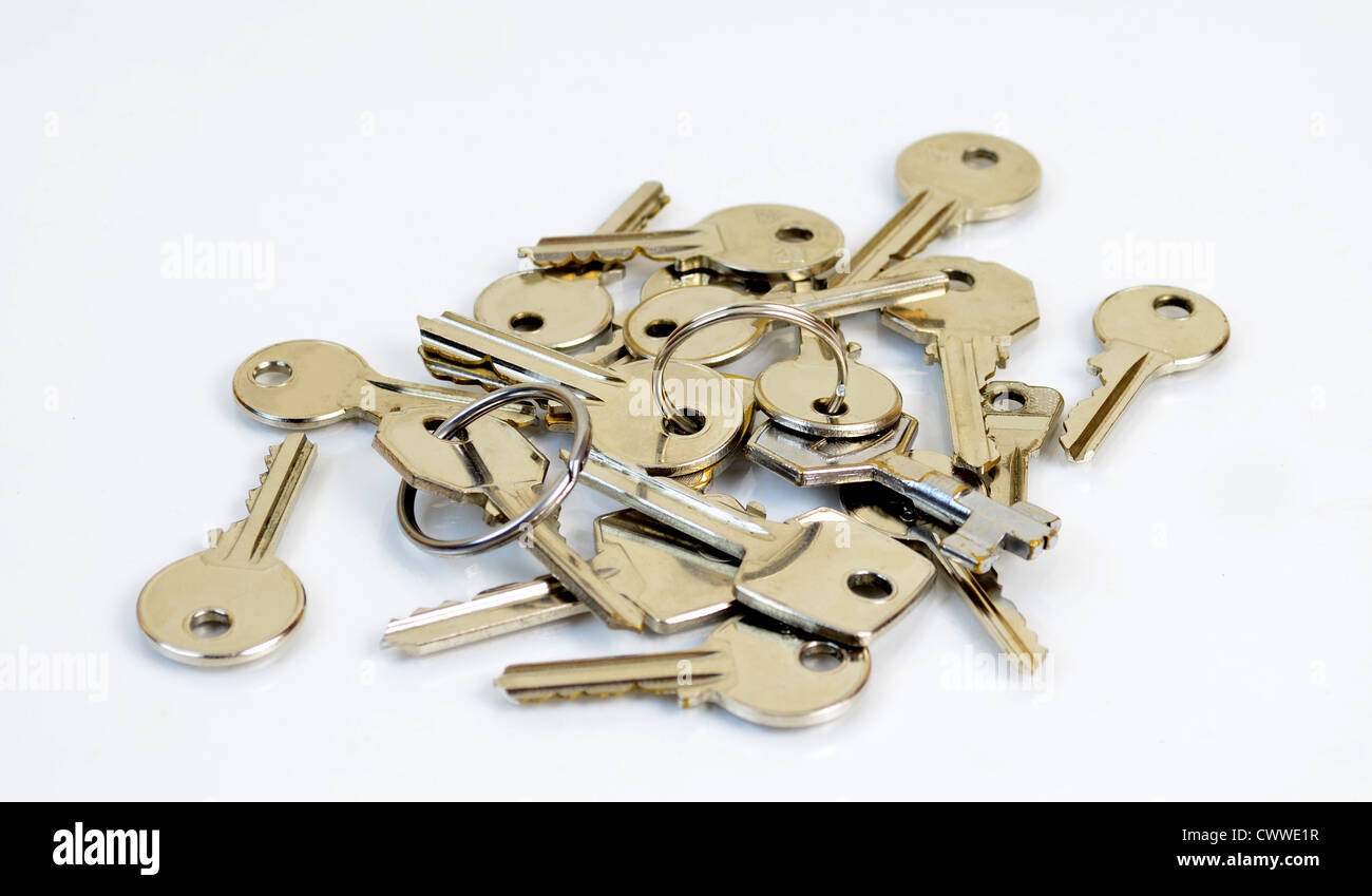 Bunch of metal keys isolated on white background Stock Photo - Alamy