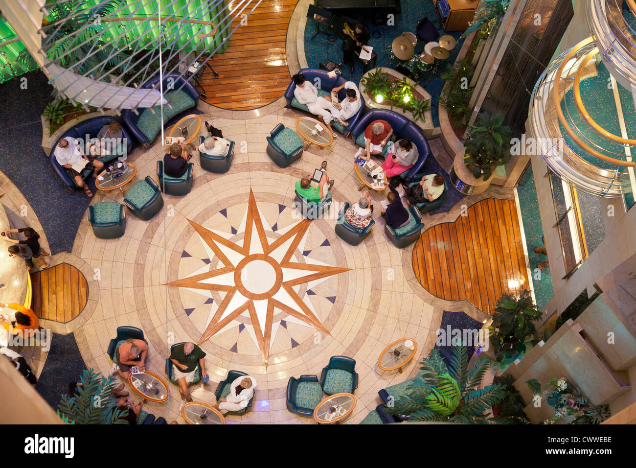 Cruise passengers in the Atrium of Royal Caribbean's Radiance of the ...