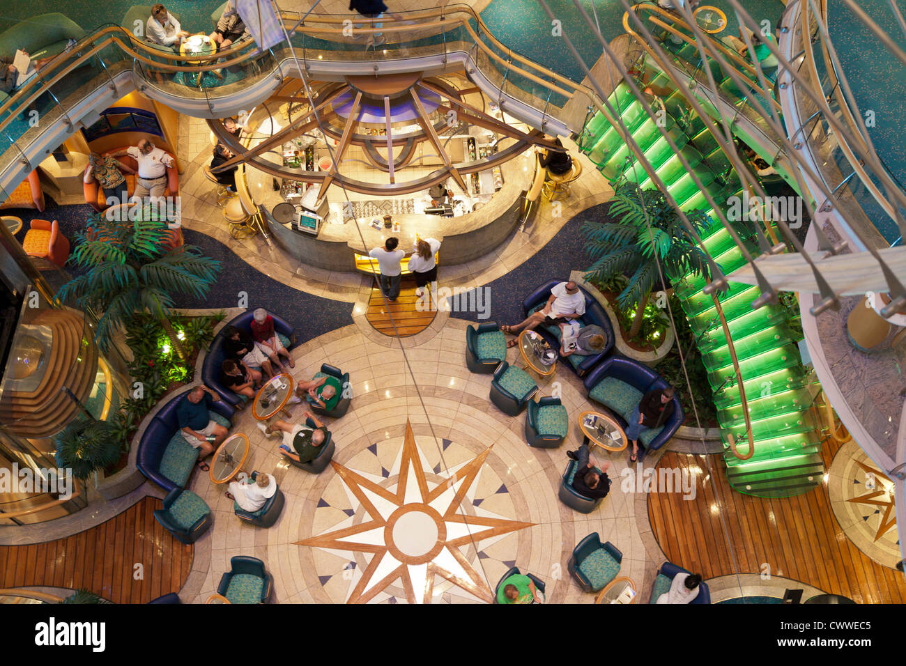 Cruise passengers in the Atrium of Royal Caribbean's Radiance of the ...