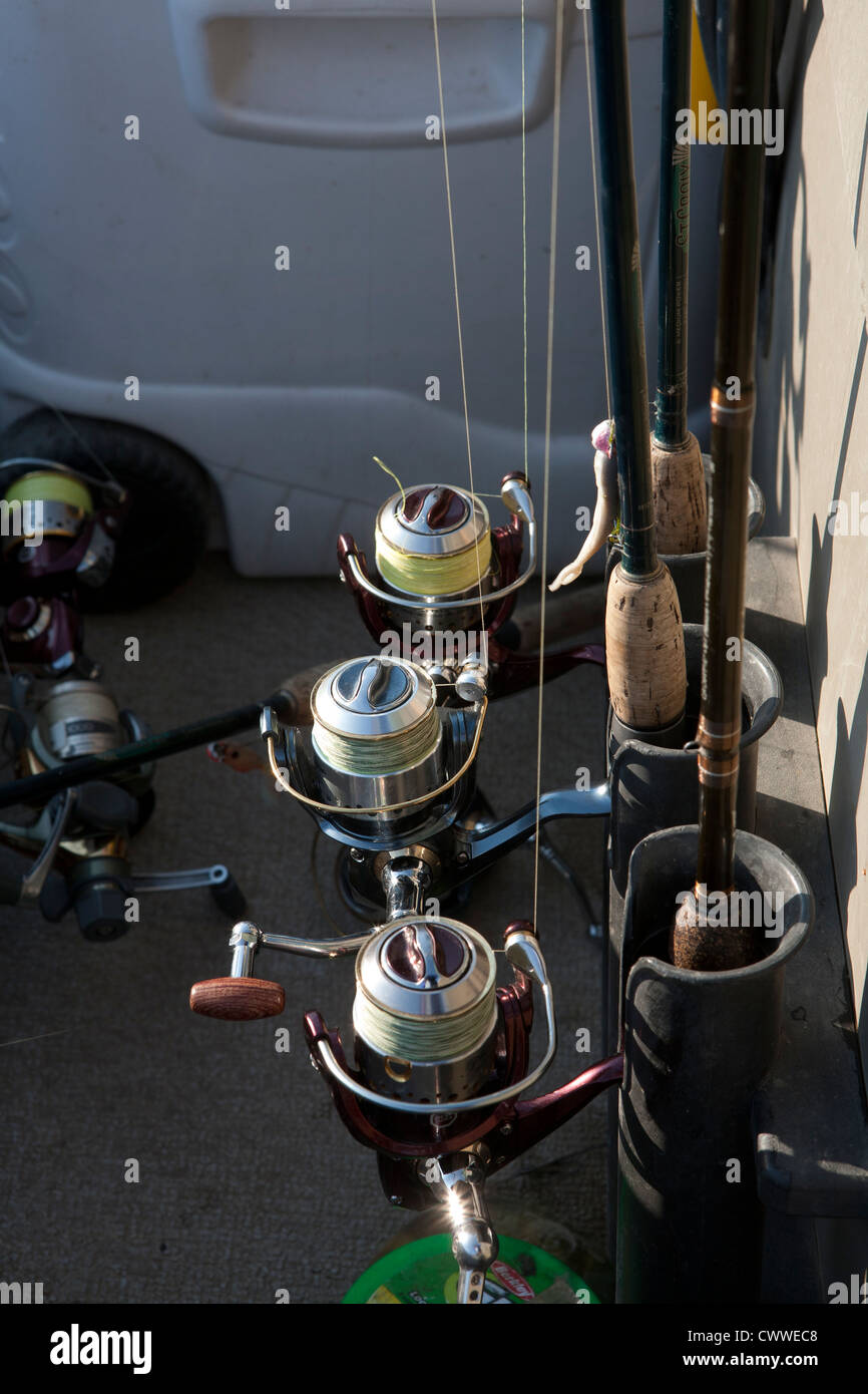 Spinning poles in a rack are all rigged and ready for the next walleye ...