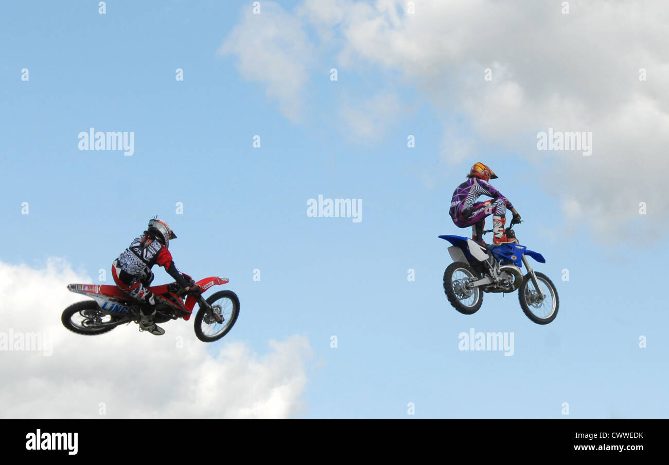 motor bikes jumping ramps to heights of 35 feet Stock Photo - Alamy