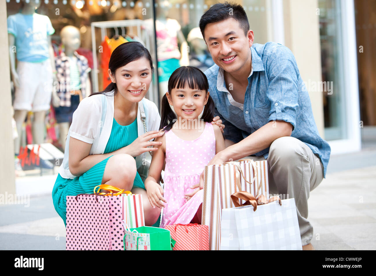 Family shopping in department store Stock Photo - Alamy