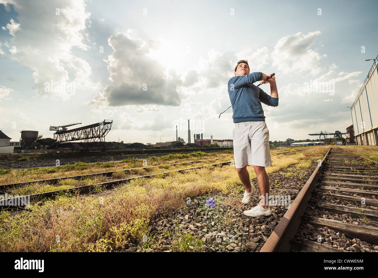 Man playing golf on train tracks hi-res stock photography and images ...