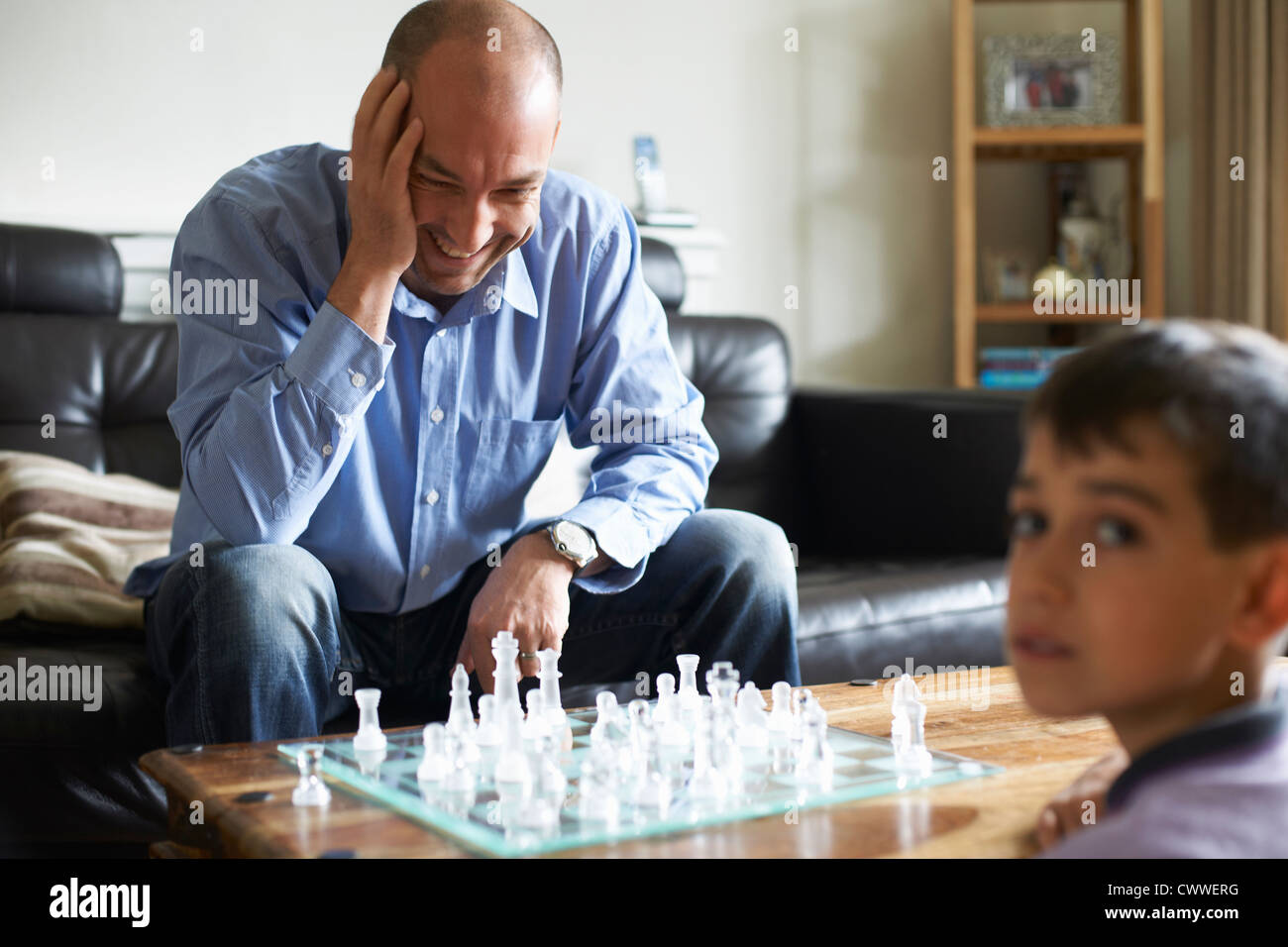 Father and son playing chess together Stock Photo - Alamy