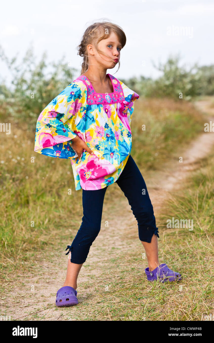happy little girl are dancing on the field Stock Photo - Alamy