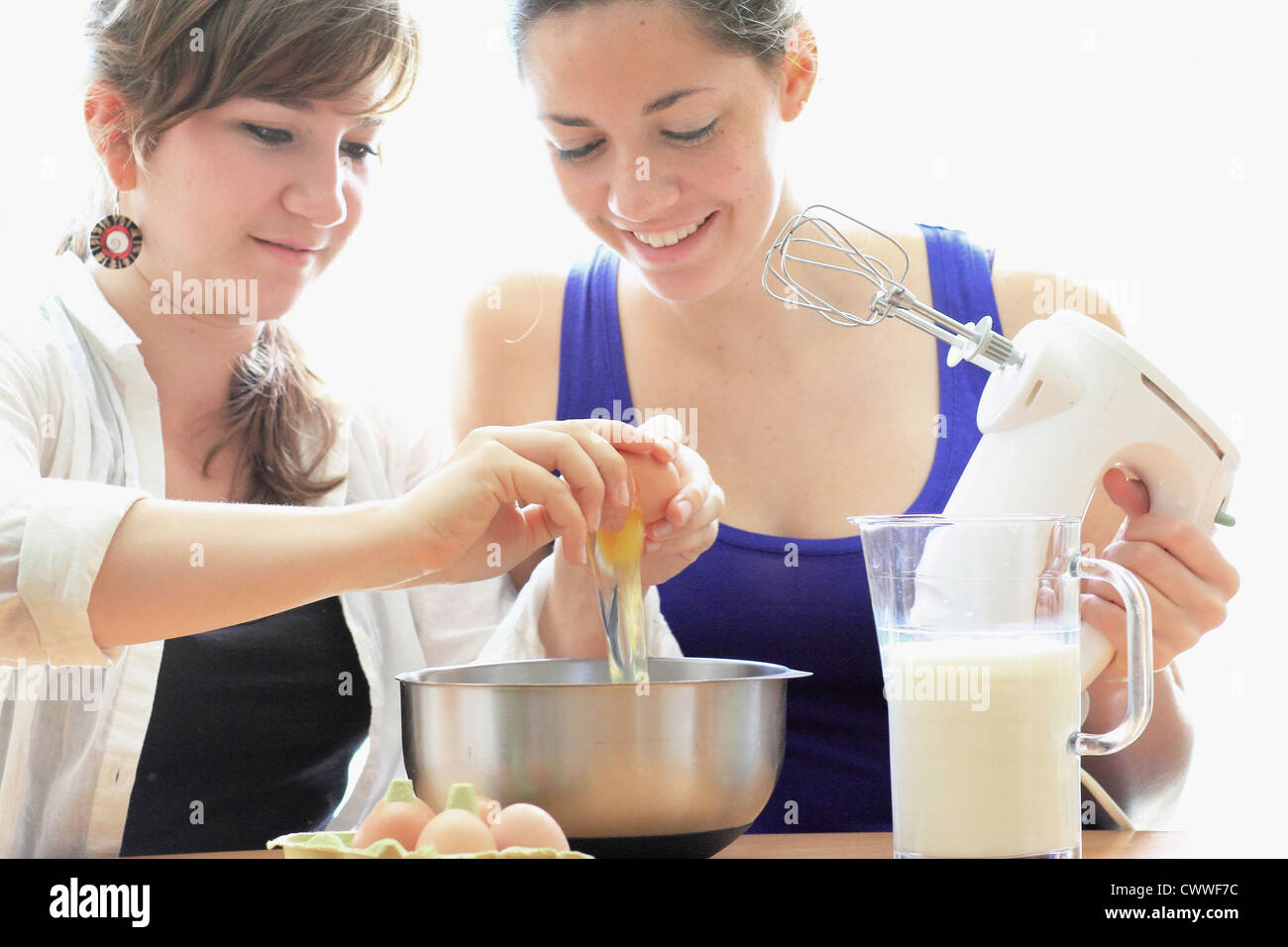 Teenage girls cooking together Stock Photo - Alamy